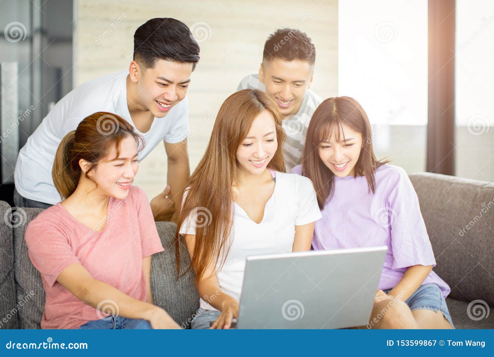 Young People Watching the Laptop on the Couch Stock Image - Image of ...