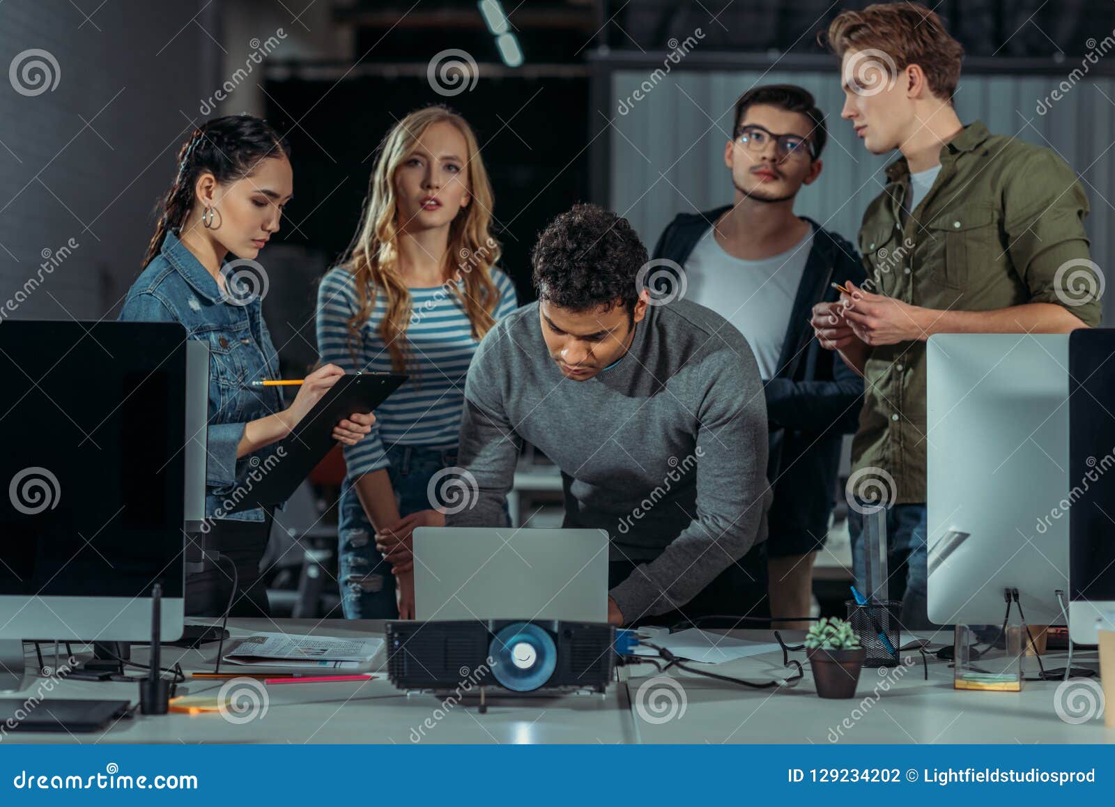 Young People Watching Presentation in Modern Office Stock Photo - Image ...