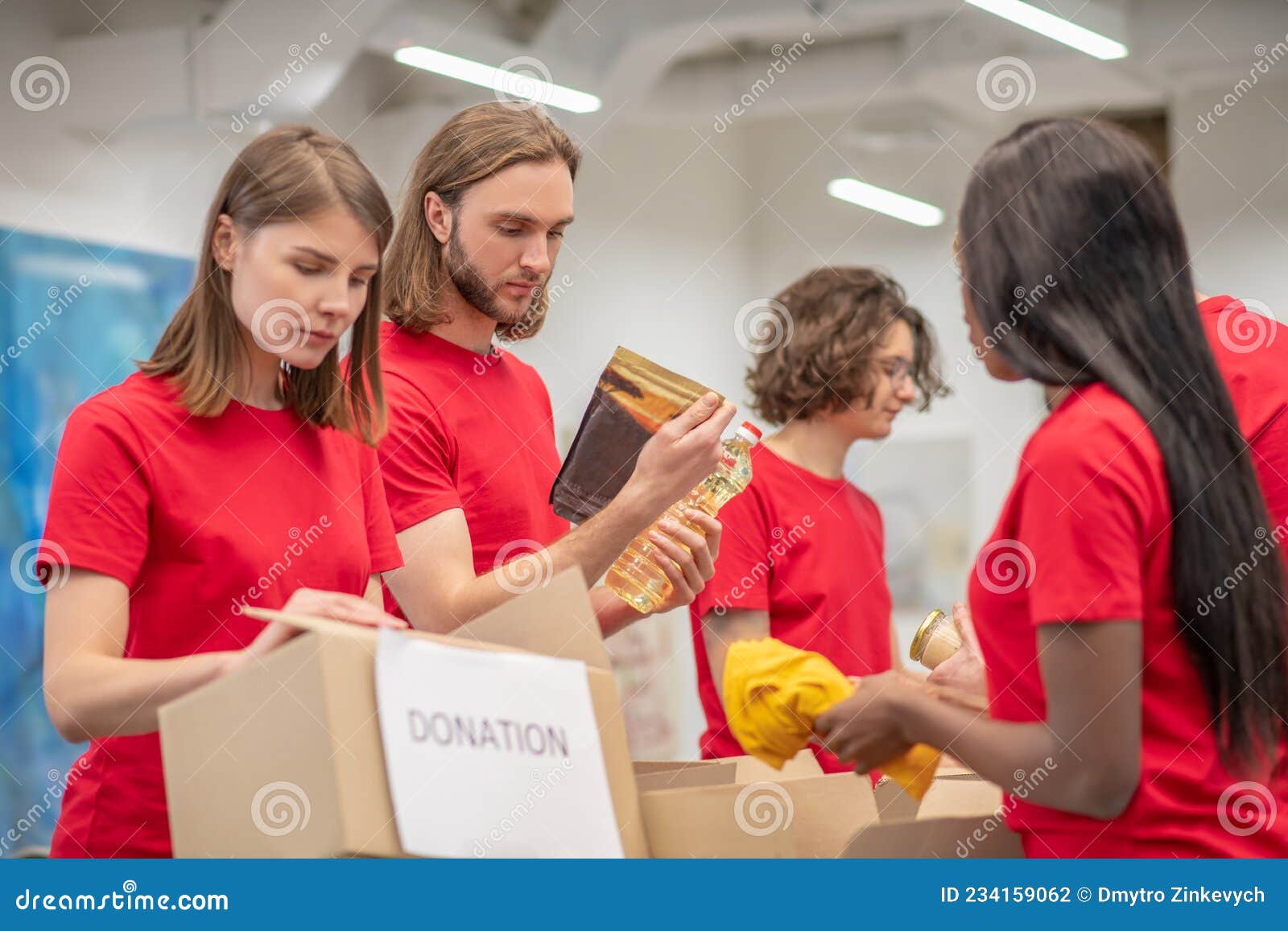 Young People Working in a Donations Distribution Center Stock Photo ...
