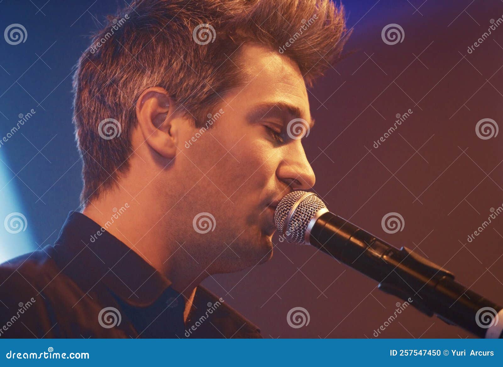 A Young Performer Singing into a Microphone. this Concert Was Created ...