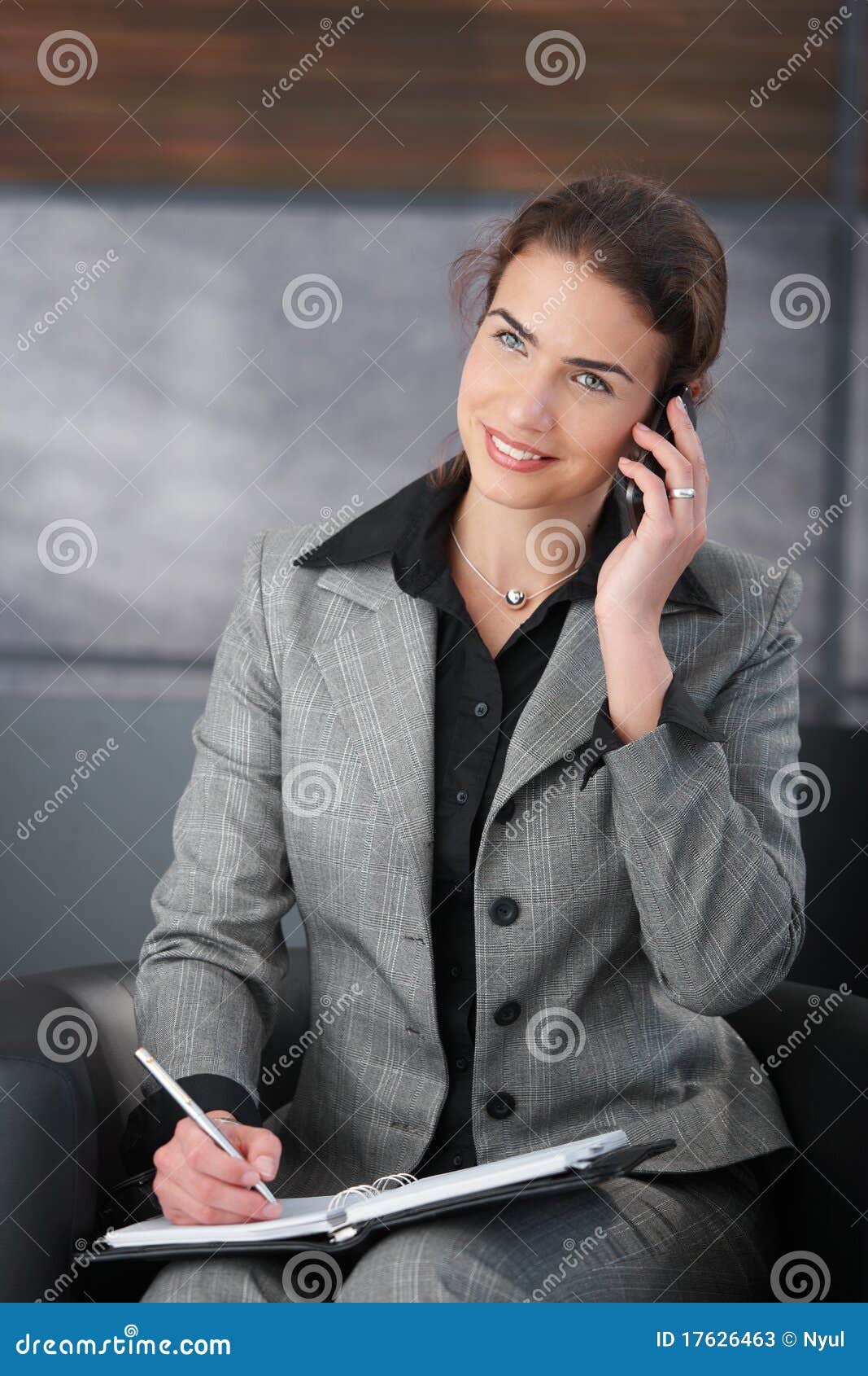 Young Personal Assistant Using Mobile Smiling Stock Image - Image of ...