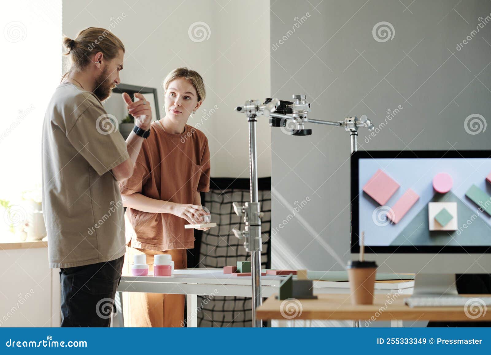 Young Photographer Explaining His Assistant How To Make Composition ...