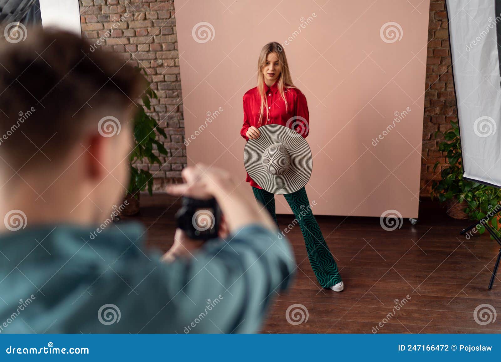 Young Photographer Taking Picures of Model, Backstage of Photoshooting ...