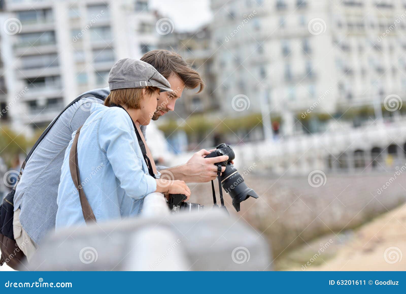 Young Photographers Checking Photo Shots Stock Image - Image of ...