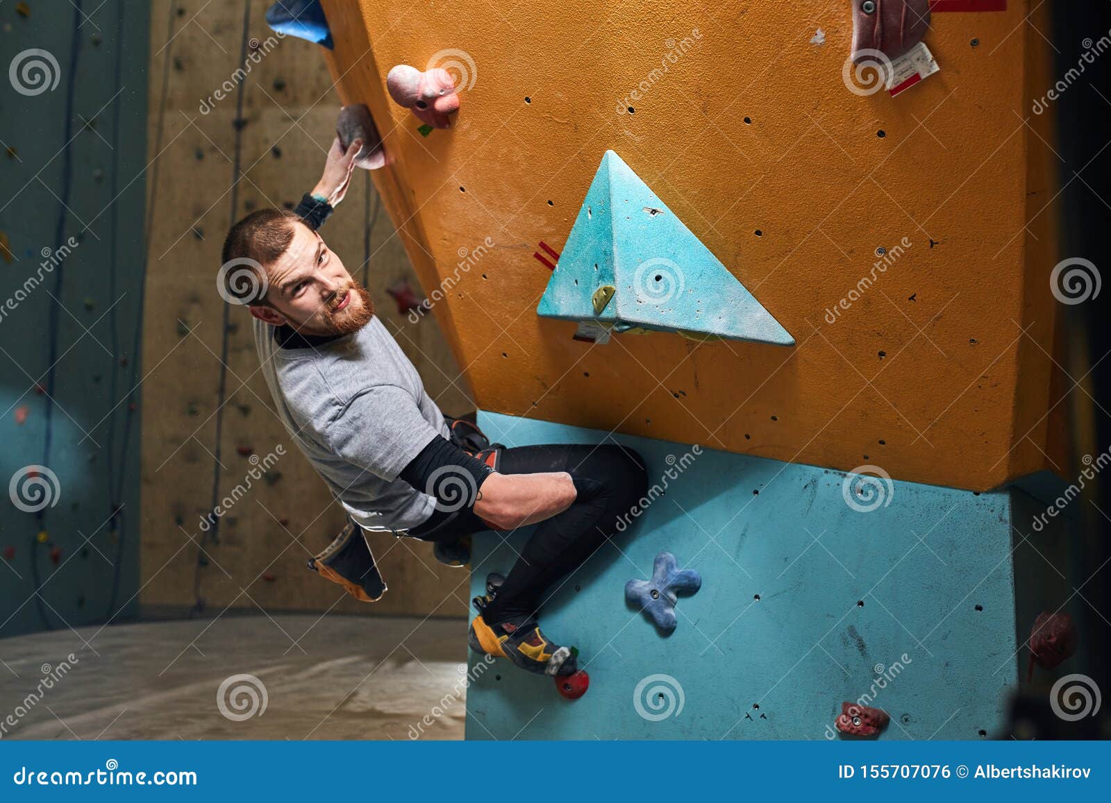 Young Physically Challenged Boulderer Hanging at Colourful Climbing ...