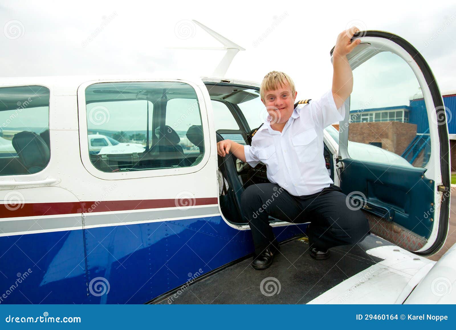 Young Pilot with Down Syndrome at Aircraft. Stock Photo - Image of ...