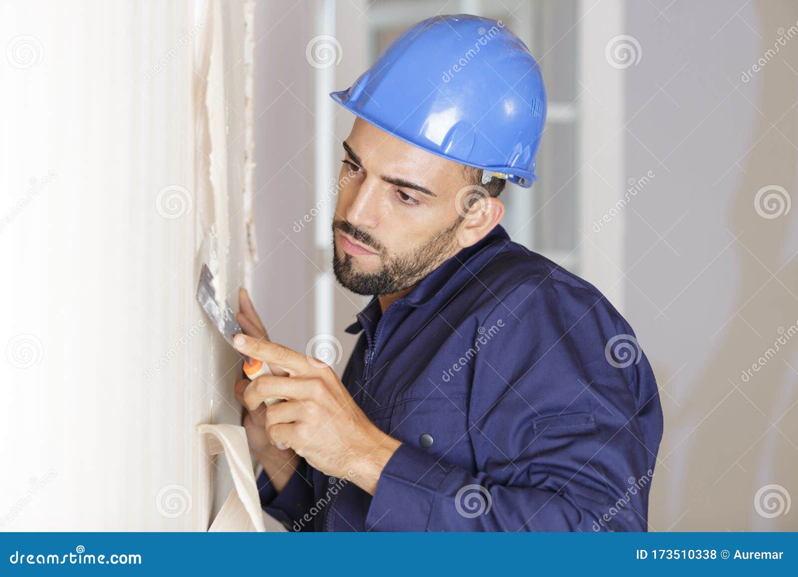 Young plasterer at work stock photo. Image of hand, building - 173510338