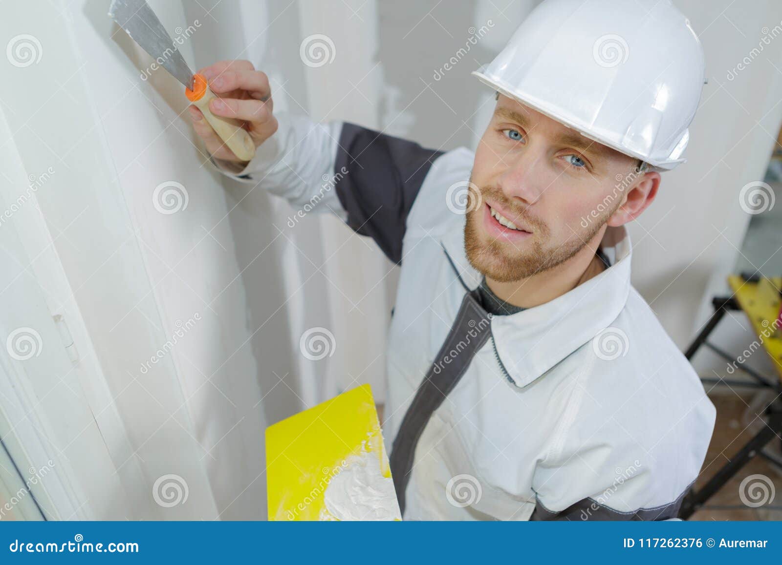 Young plasterer at work stock photo. Image of architecture - 117262376