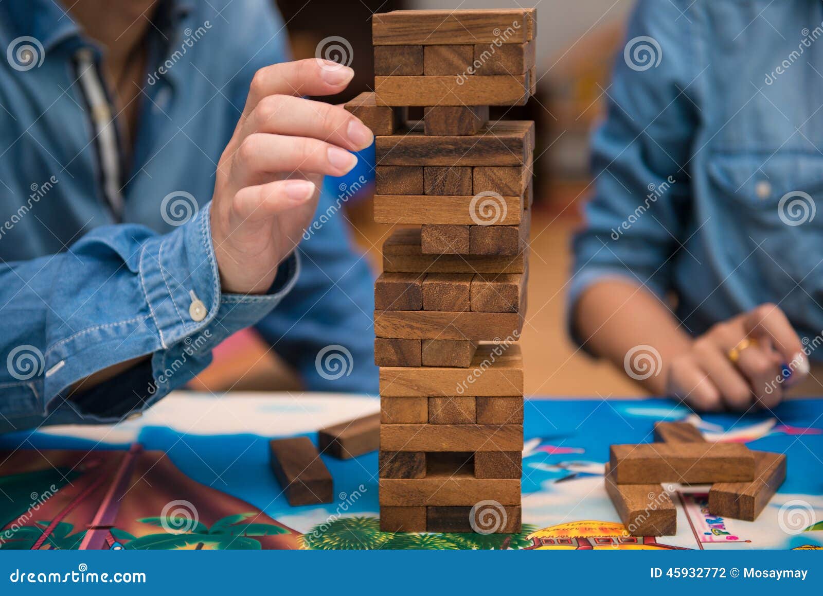 Young are Playing Jenga Wood Game Stock Photo - Image of puzzle, jenga ...