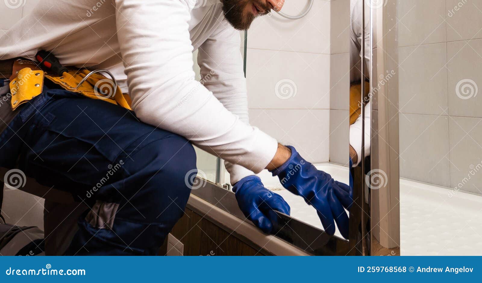 Young Plumber Fixing Shower Cabin. Stock Photo - Image of occupation ...