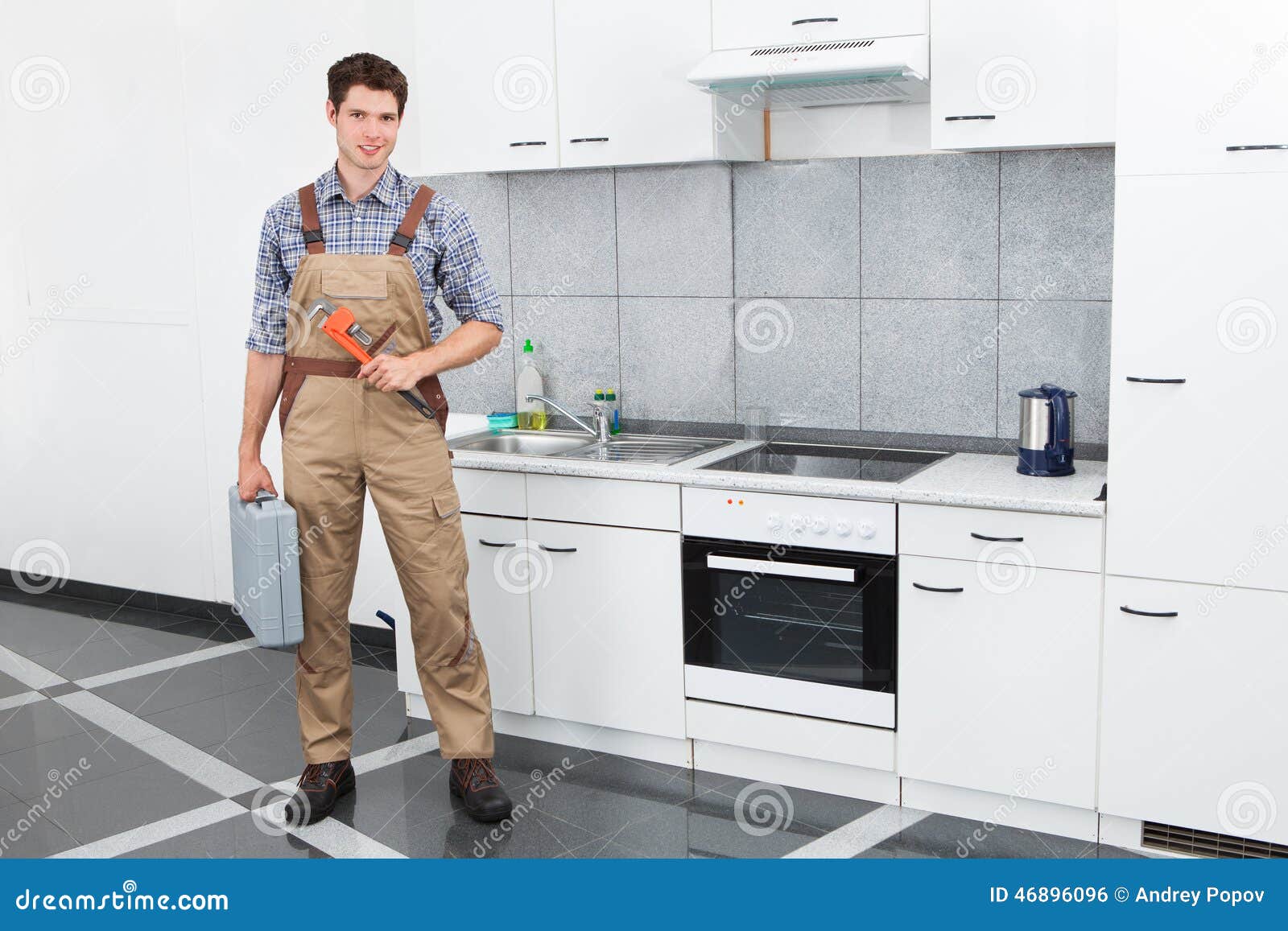 Mad Plumber Holding Steel Wrench In Closeup Stock Photo | CartoonDealer ...