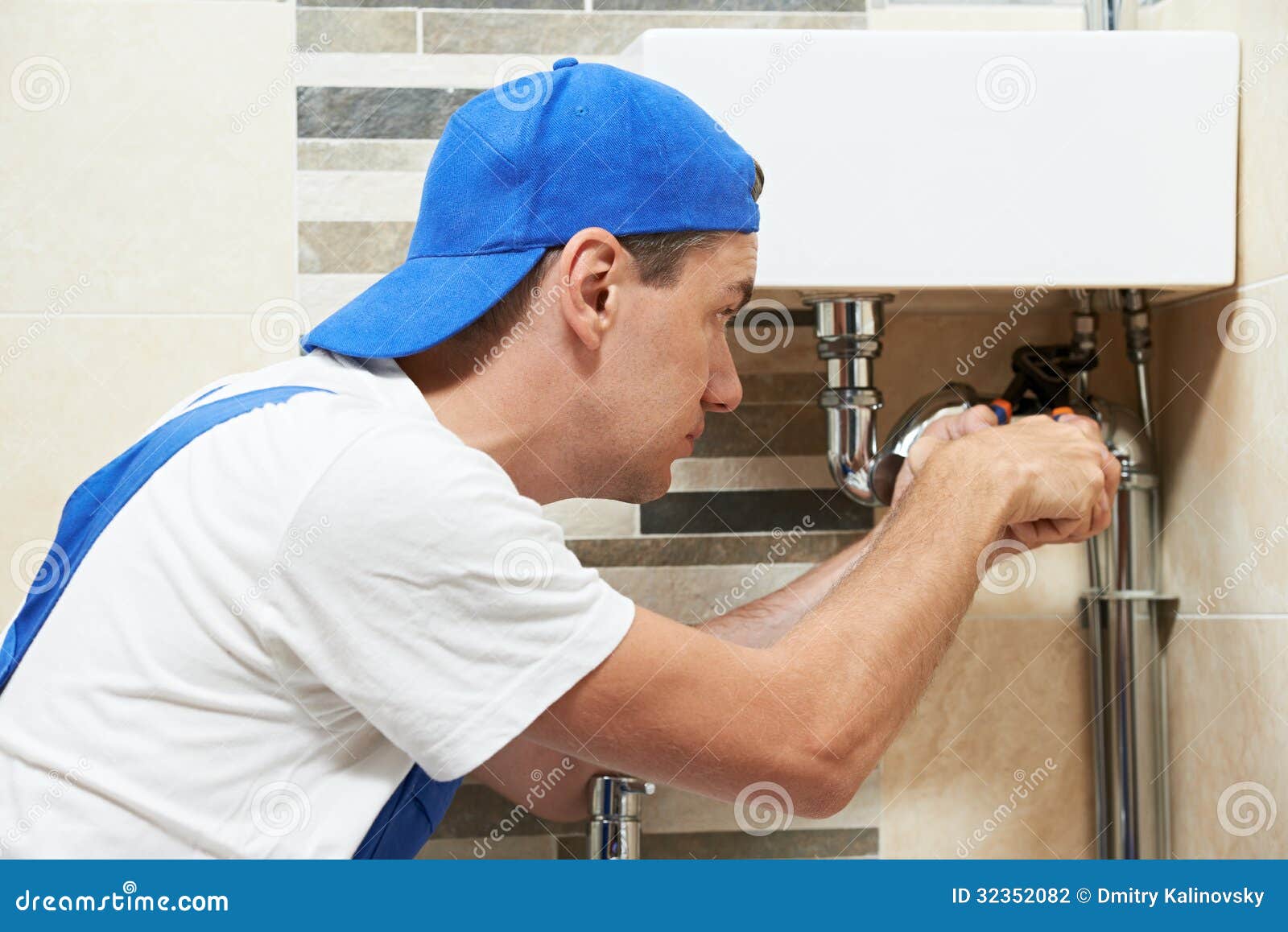 Young plumber man worker stock photo. Image of plumbing - 32352082