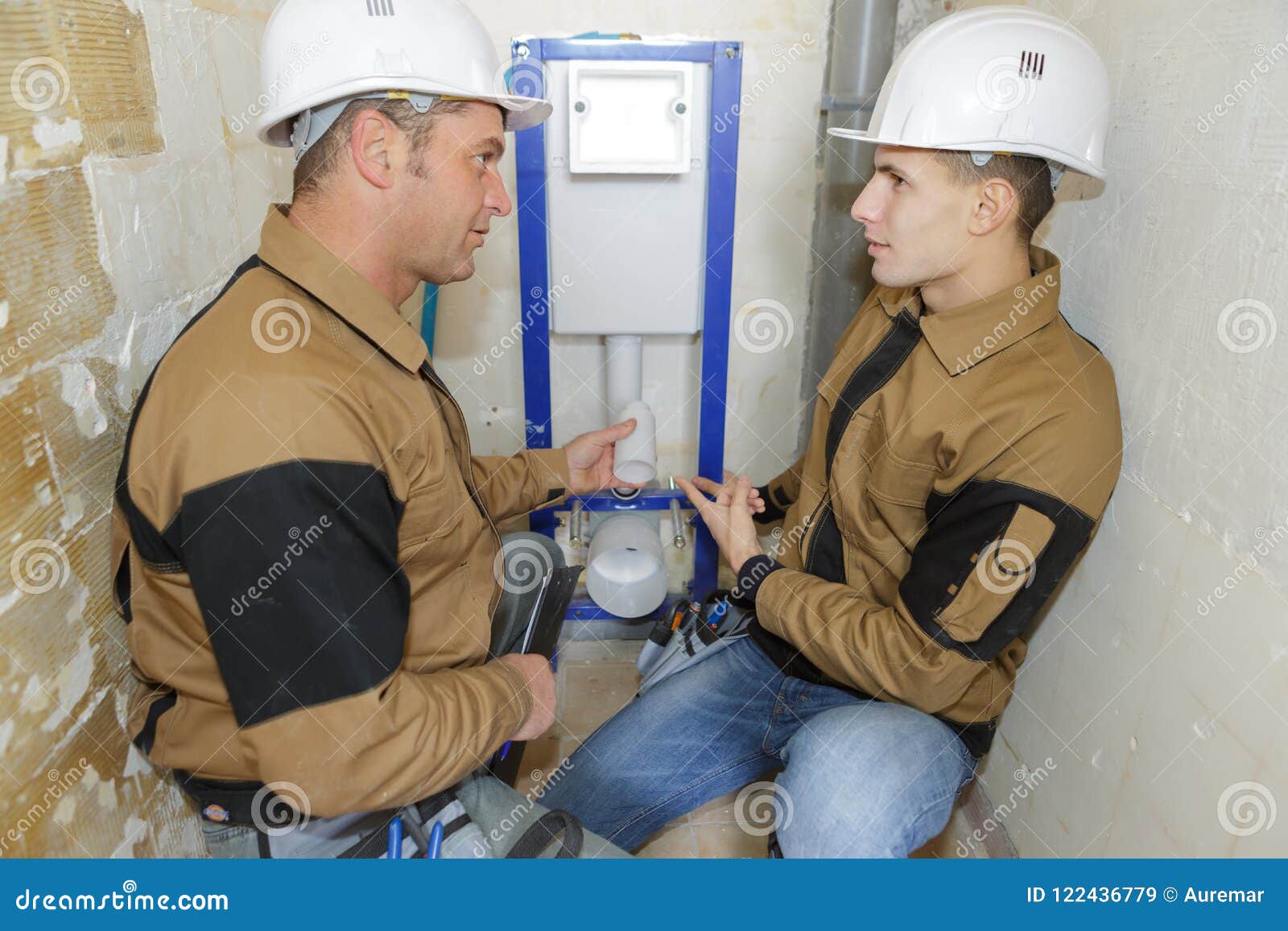 Young Plumber with Manager Working Indoors Stock Image - Image of ...