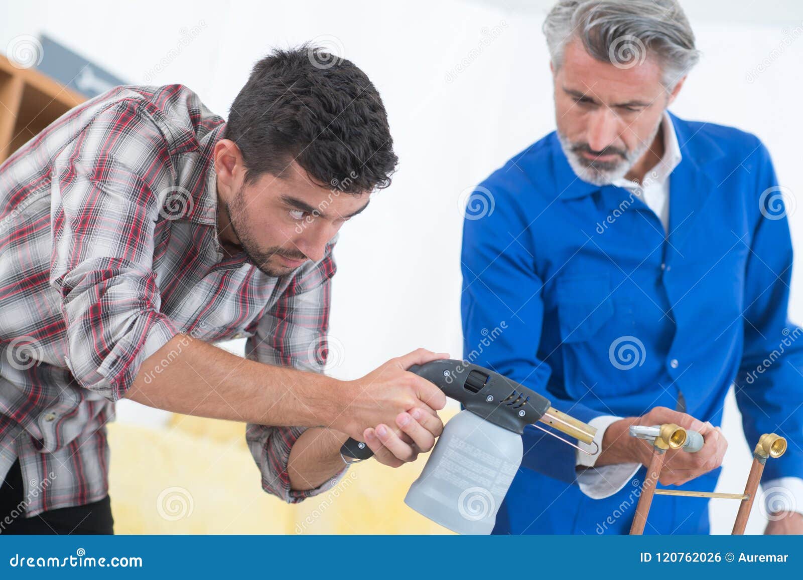 Young Plumber and Supervisor Using Welding Gas Torch Stock Photo ...