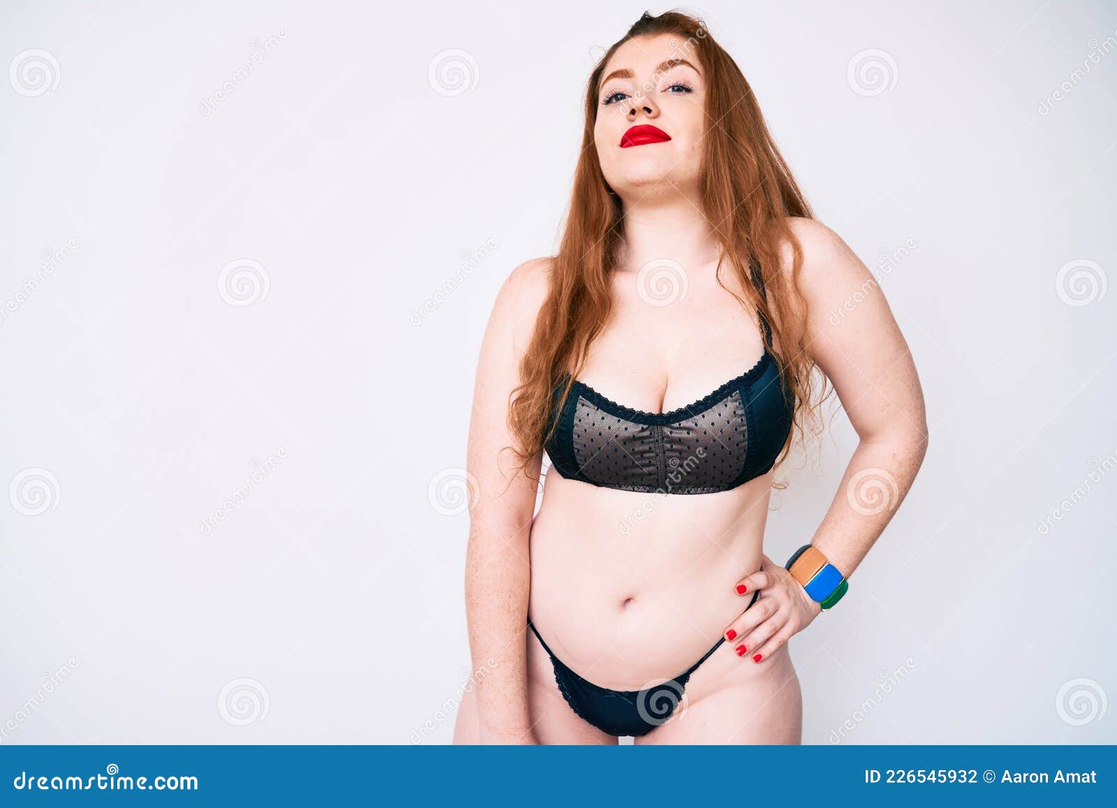 Young Plus Size Redhead Woman Wearing Lingerie Standing Over Isolated