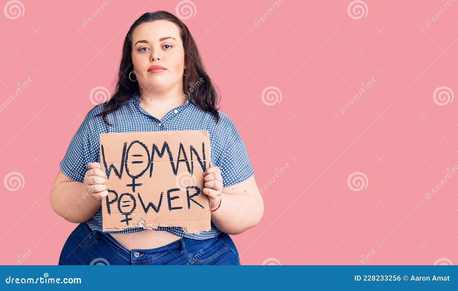 Young Plus Size Woman Holding Woman Power Banner Thinking Attitude and ...