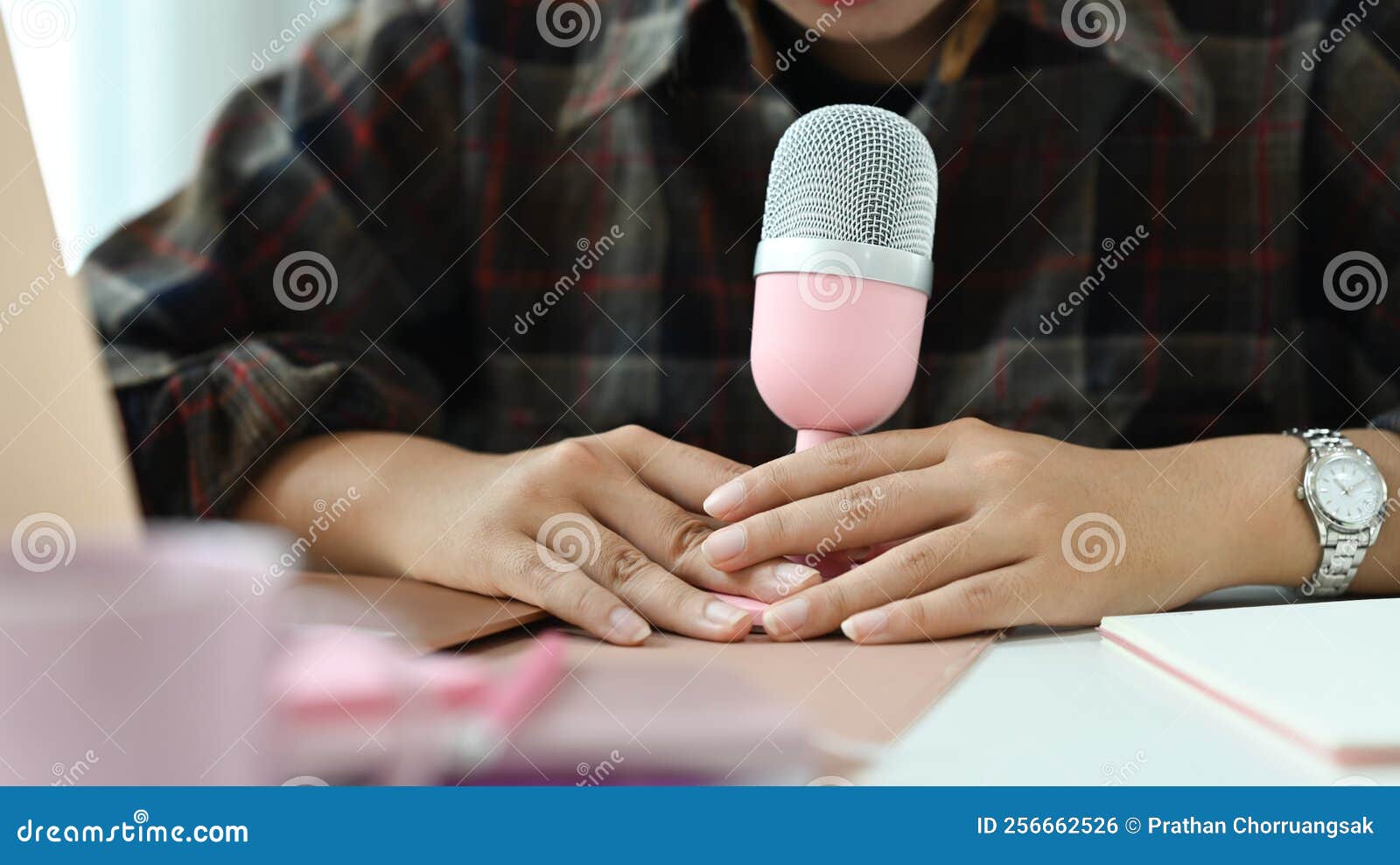Young Podcaster Using a Microphone and Laptop Computer Recording Audio ...