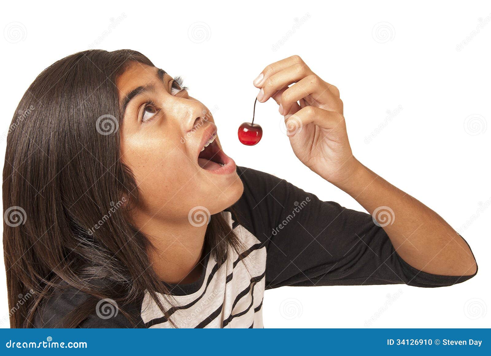 Young Polynesian Girl Eating a Cherry Stock Photo - Image of female ...