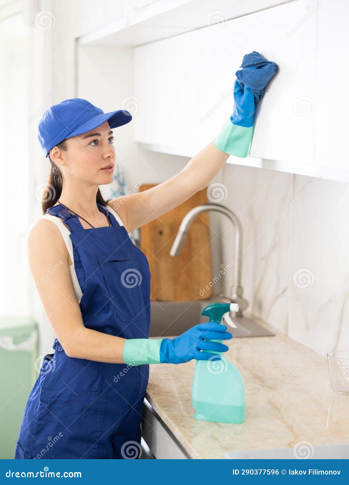 Young Positive Girl is Cleaning Kitchen Stock Photo - Image of ...