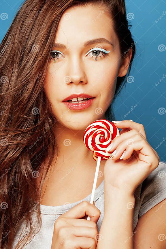 Young Pretty Adorable Woman With Candy Close Up Like Doll Stock Image