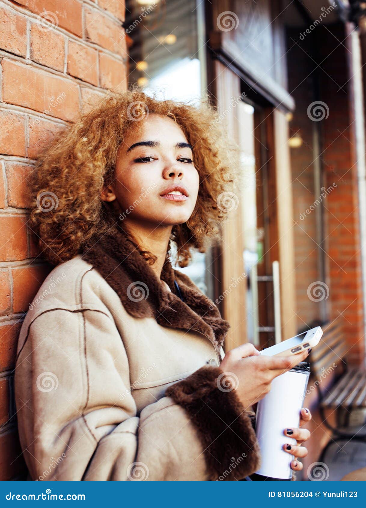 Young Pretty African American Women Drinking Coffee Outside In Cafe