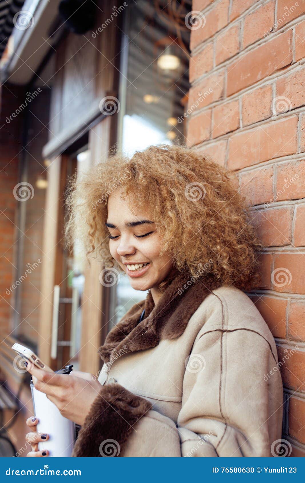 Young Pretty African American Women Drinking Coffee Outside In Cafe