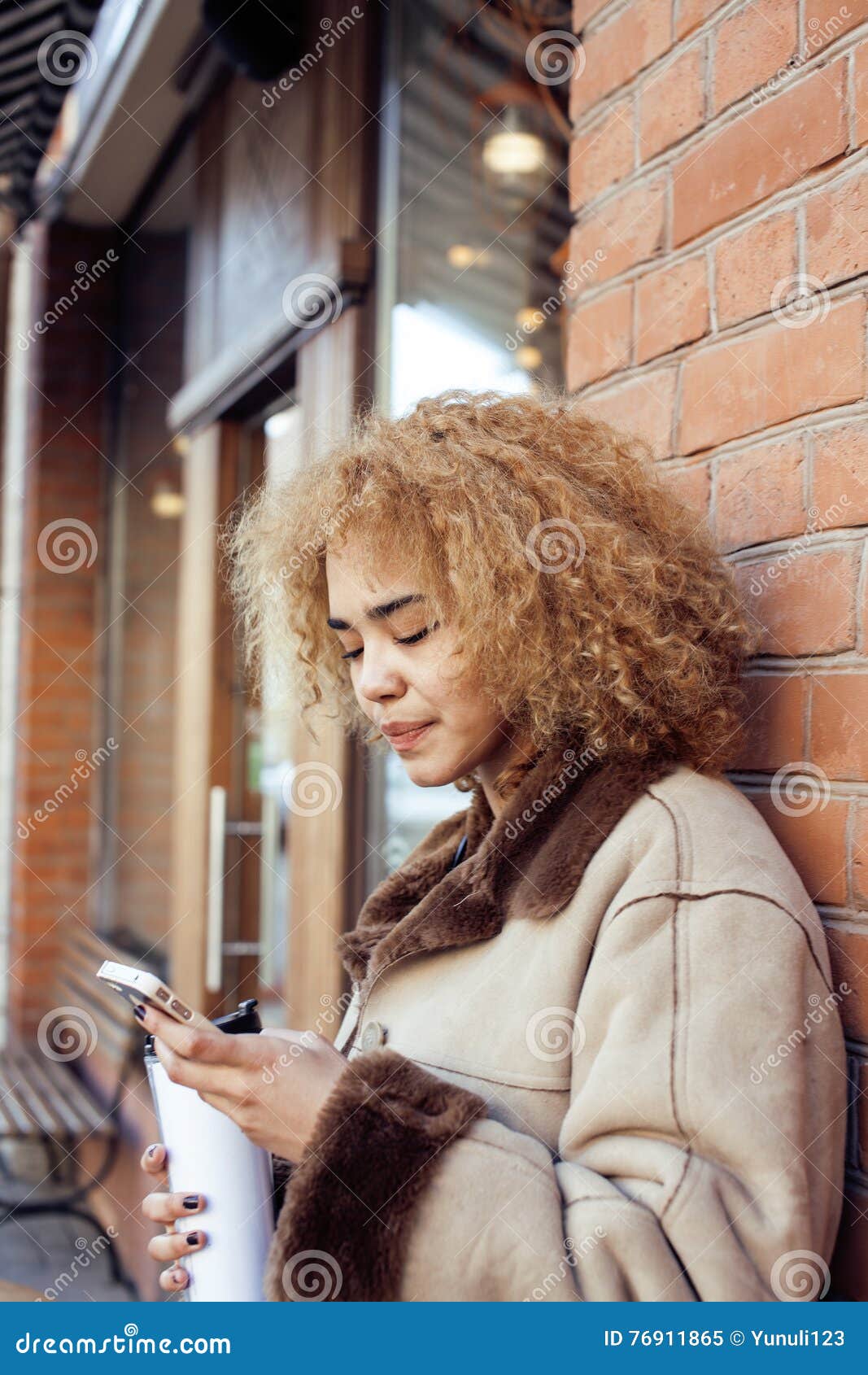 Young Pretty African American Women Drinking Coffee Outside In Cafe