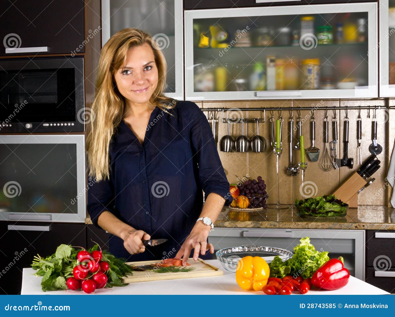 Young Pretty Blond Woman Cooking Fish in Kitchen Stock Image - Image of ...