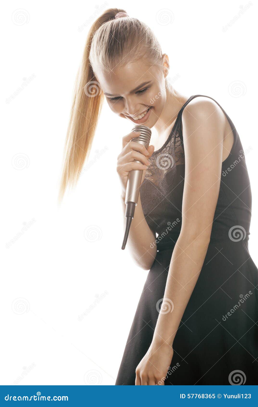 Young Pretty Blond Woman Singing in Microphone Stock Image - Image of ...