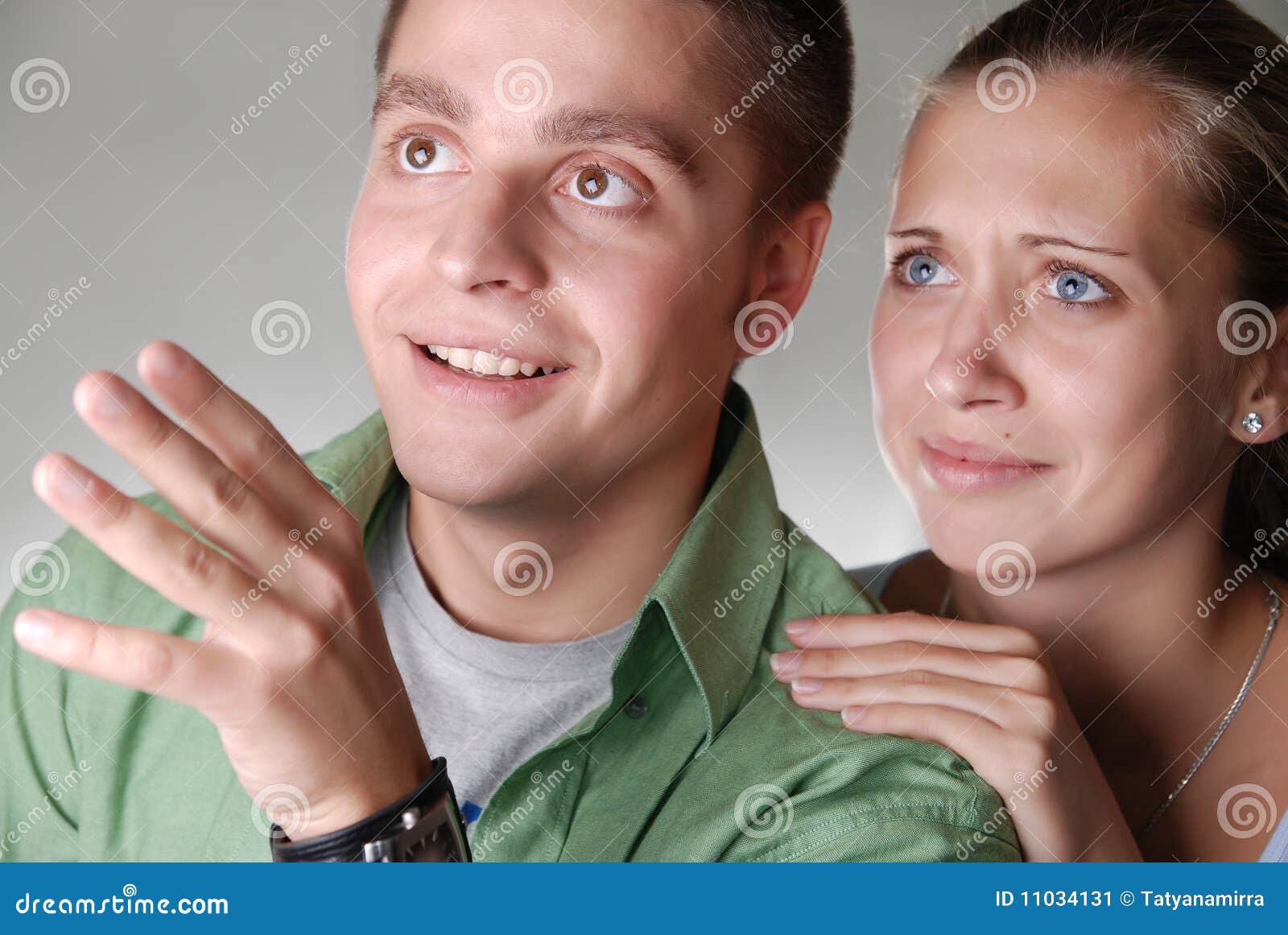 Young Pretty Couple Looking Surprisely into the Di Stock Image - Image ...