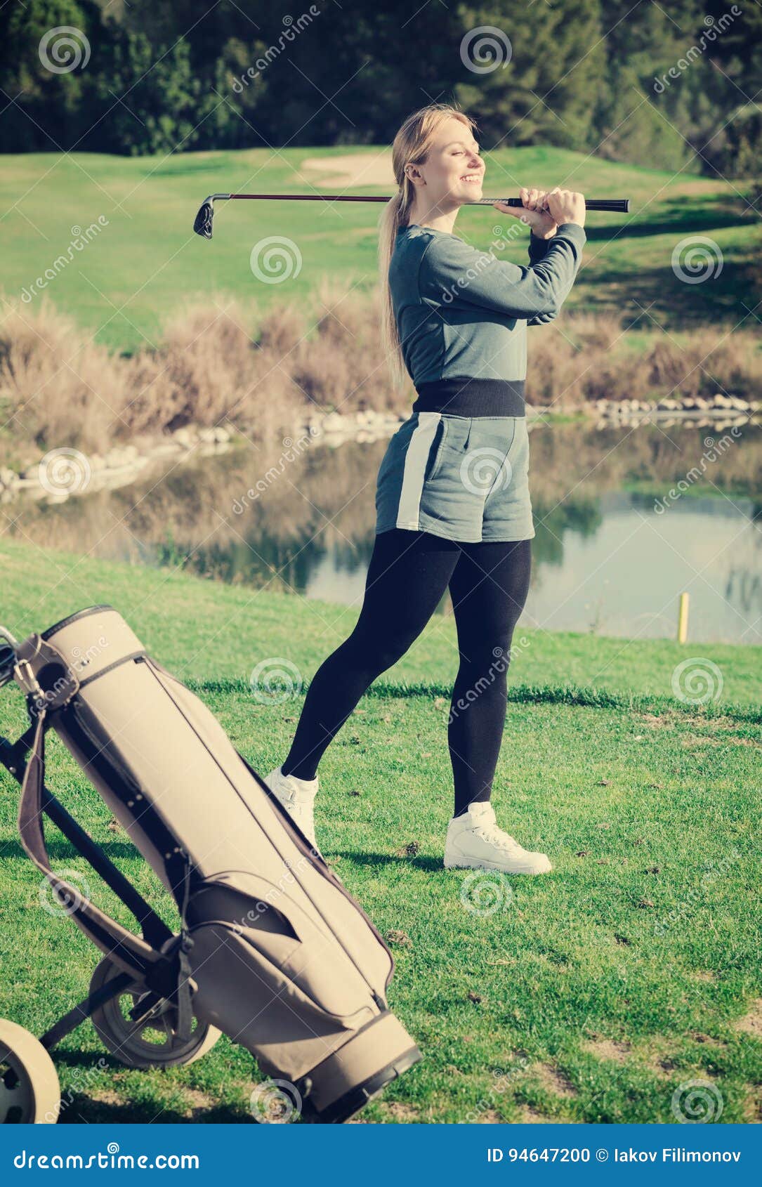 Young Pretty Female Golf Player is Succeeded in Ball Hitting Stock ...