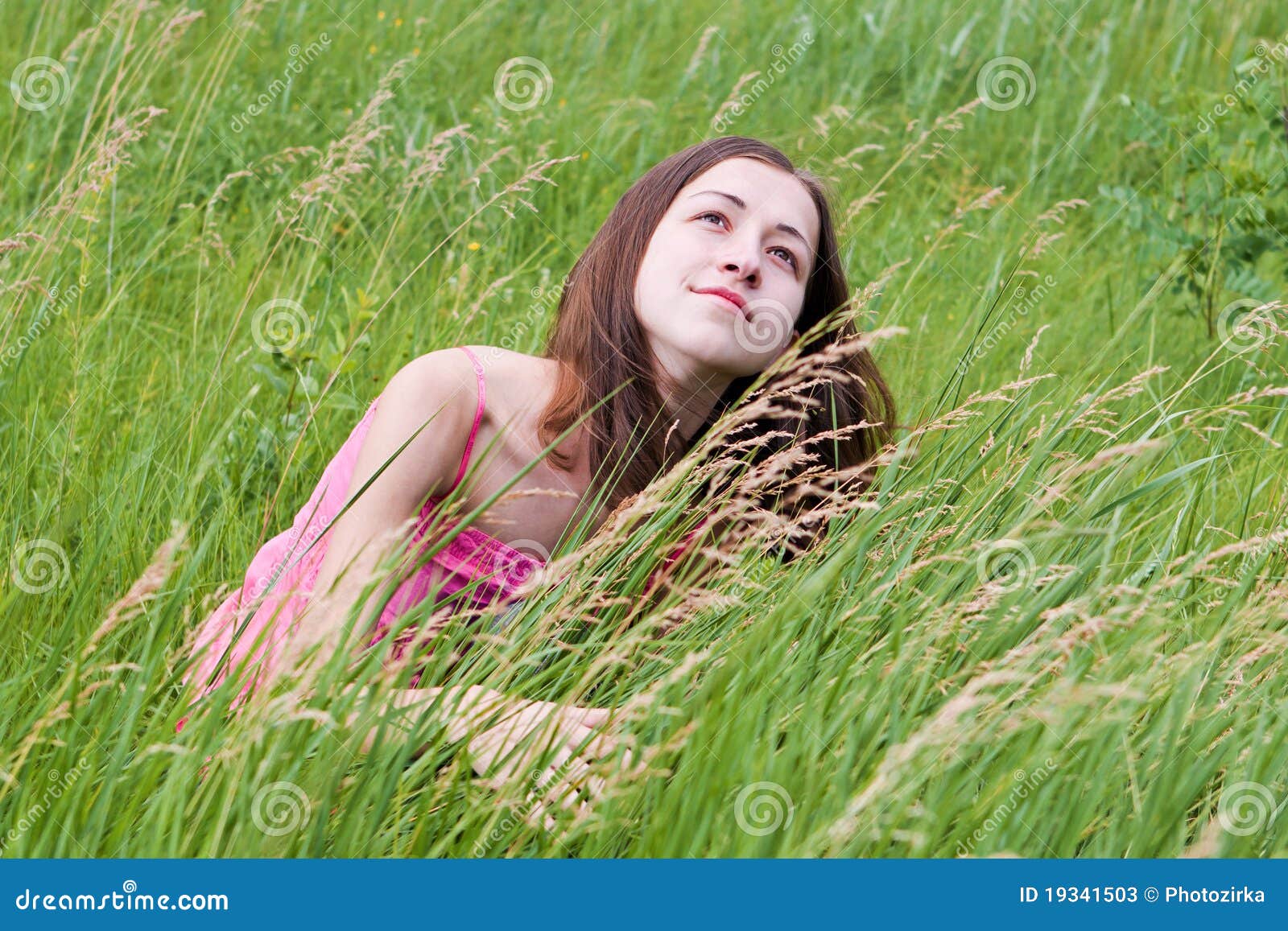 Young pretty girl on grass stock image. Image of dream - 19341503