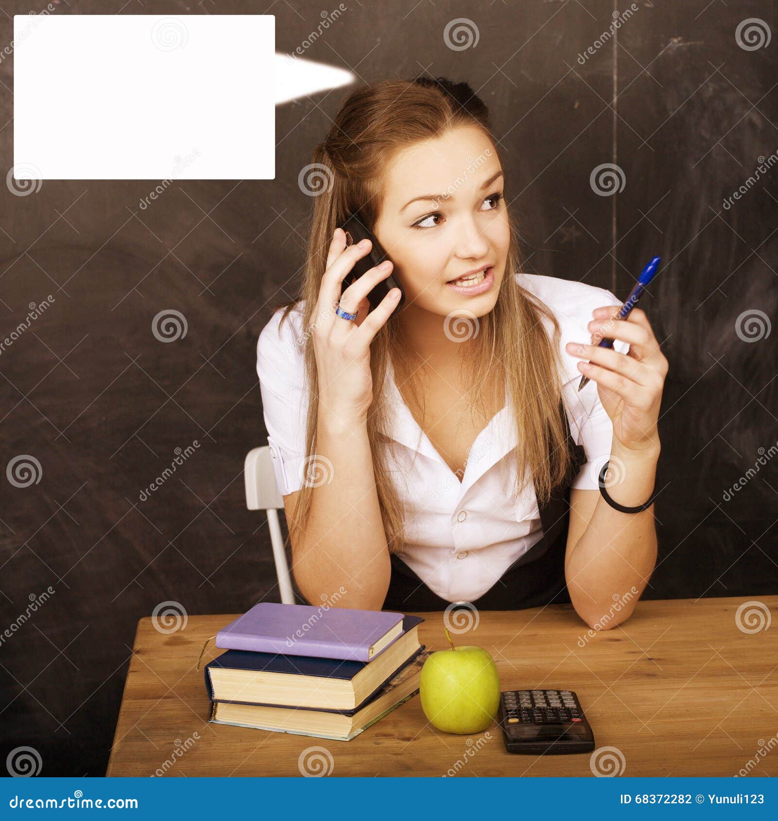 Young Pretty Girl Student in Classroom at Blackboard Stock Photo ...