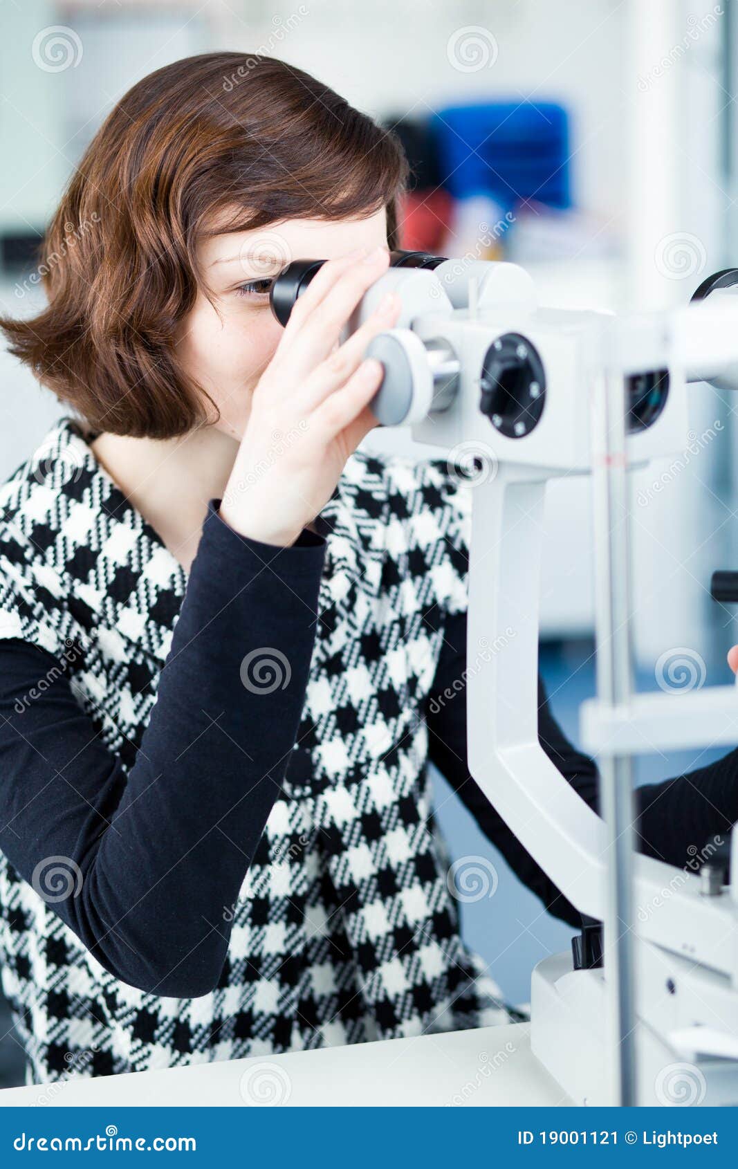Young Pretty Optometrist Using a Slit Lamp Stock Image - Image of ...