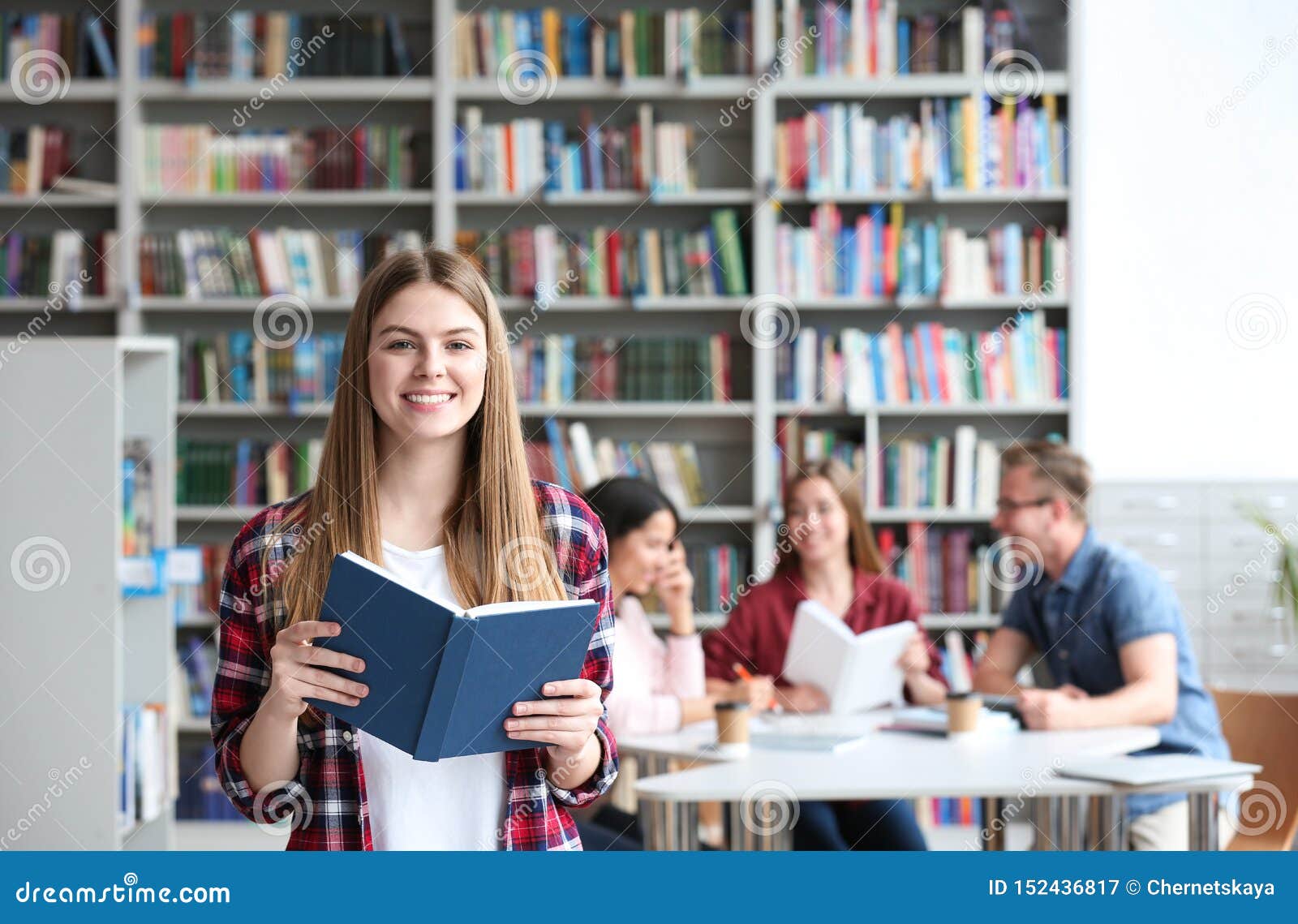 Young Pretty Woman with Book in Library Stock Image - Image of clever ...
