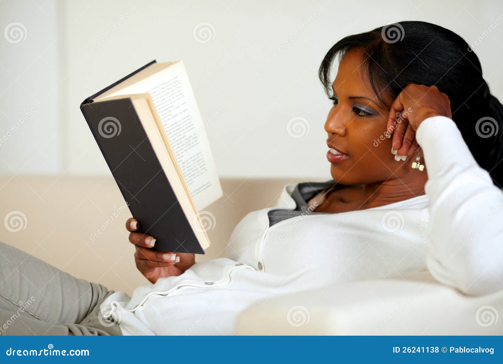 Young Pretty Woman Browsing a Book Stock Photo - Image of gorgeous ...