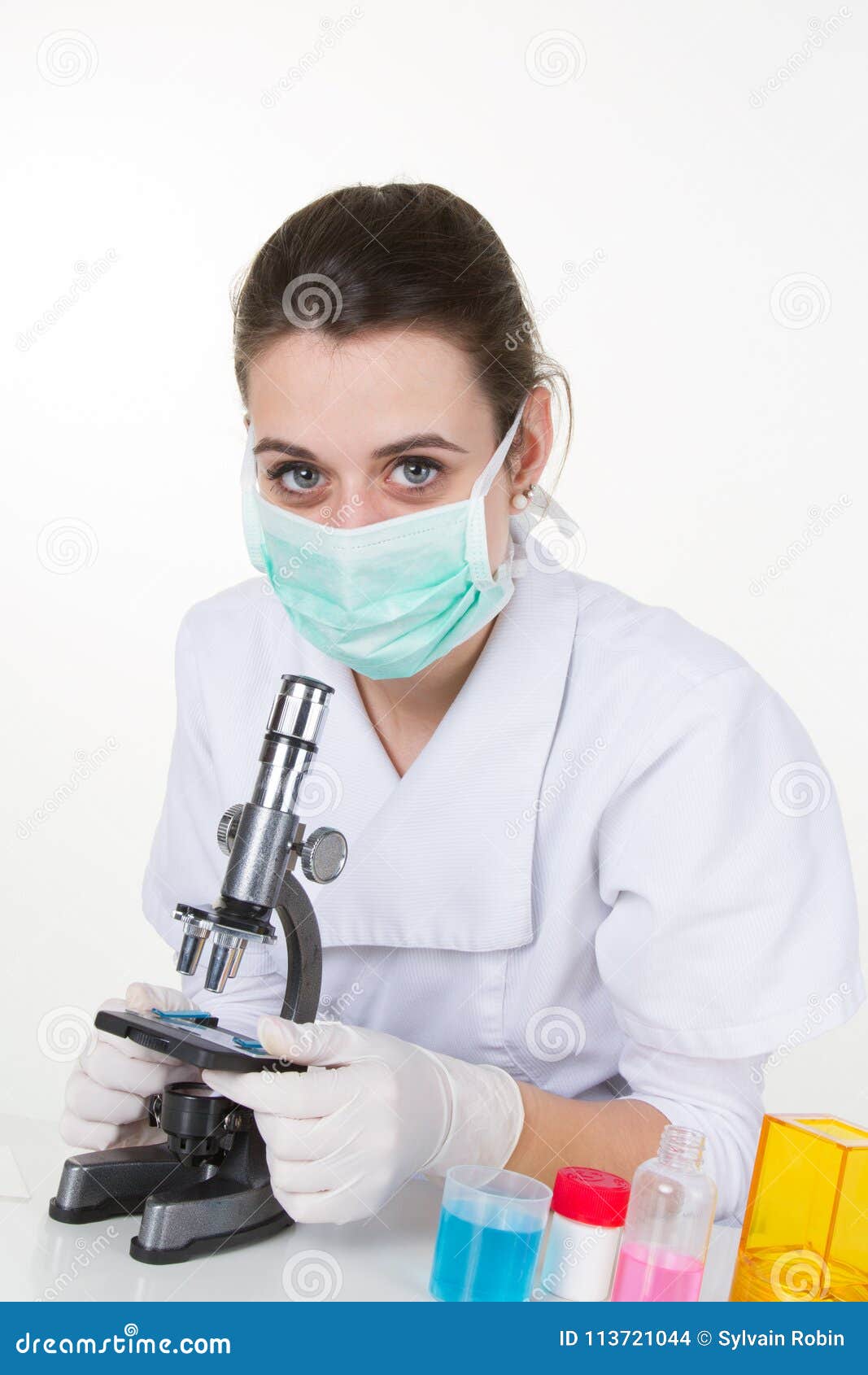 Young Pretty Woman Scientist Doing Experiments in the Laboratory with a ...