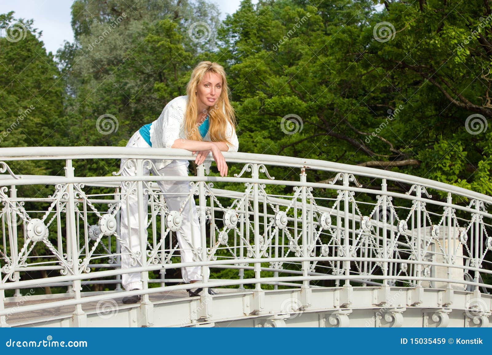Young Pretty Woman Stands on a Bridge Stock Image - Image of holiday ...