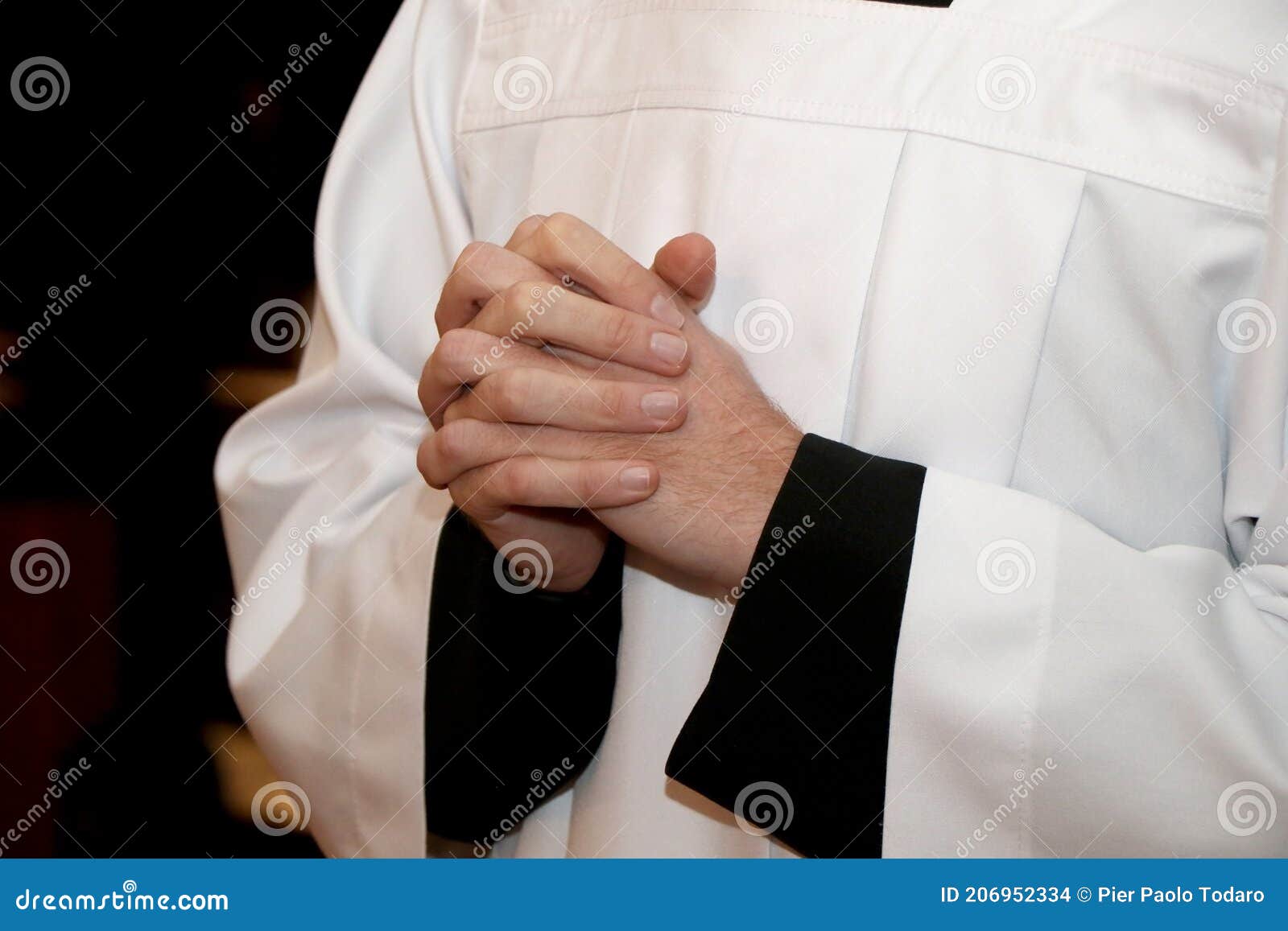 Young priest in prayer stock photo. Image of folded - 206952334