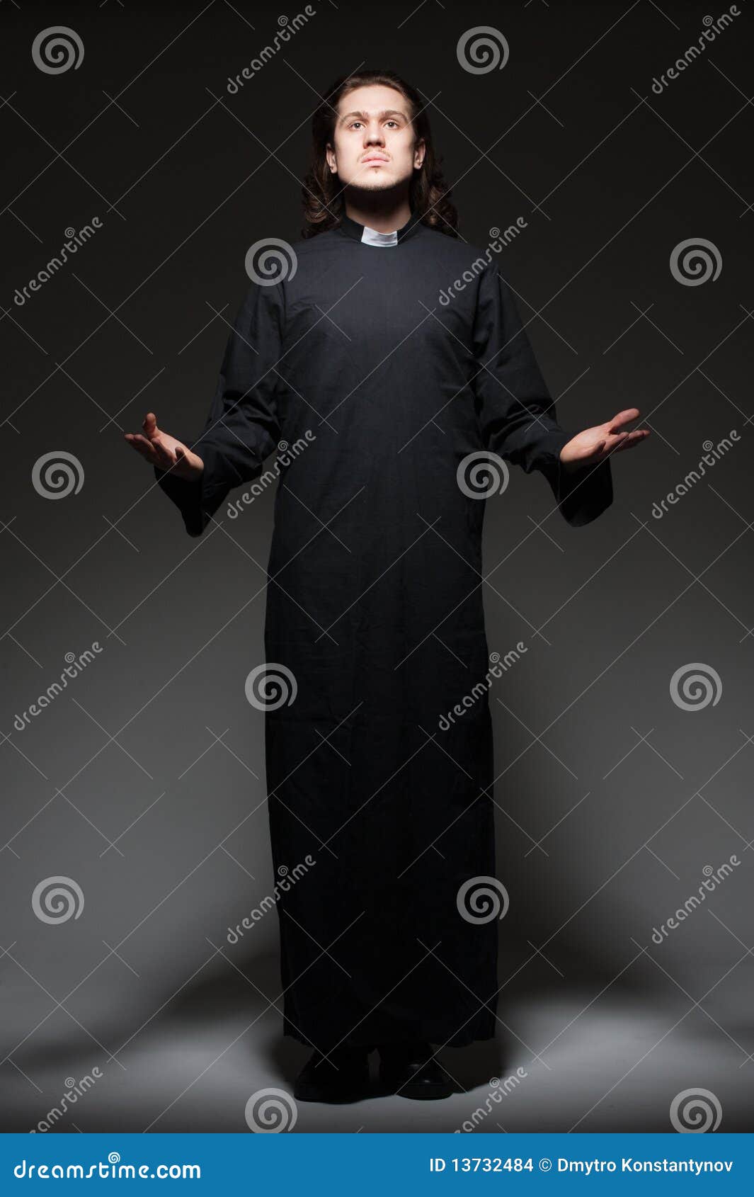 Young priest is praying stock photo. Image of christianity - 13732484