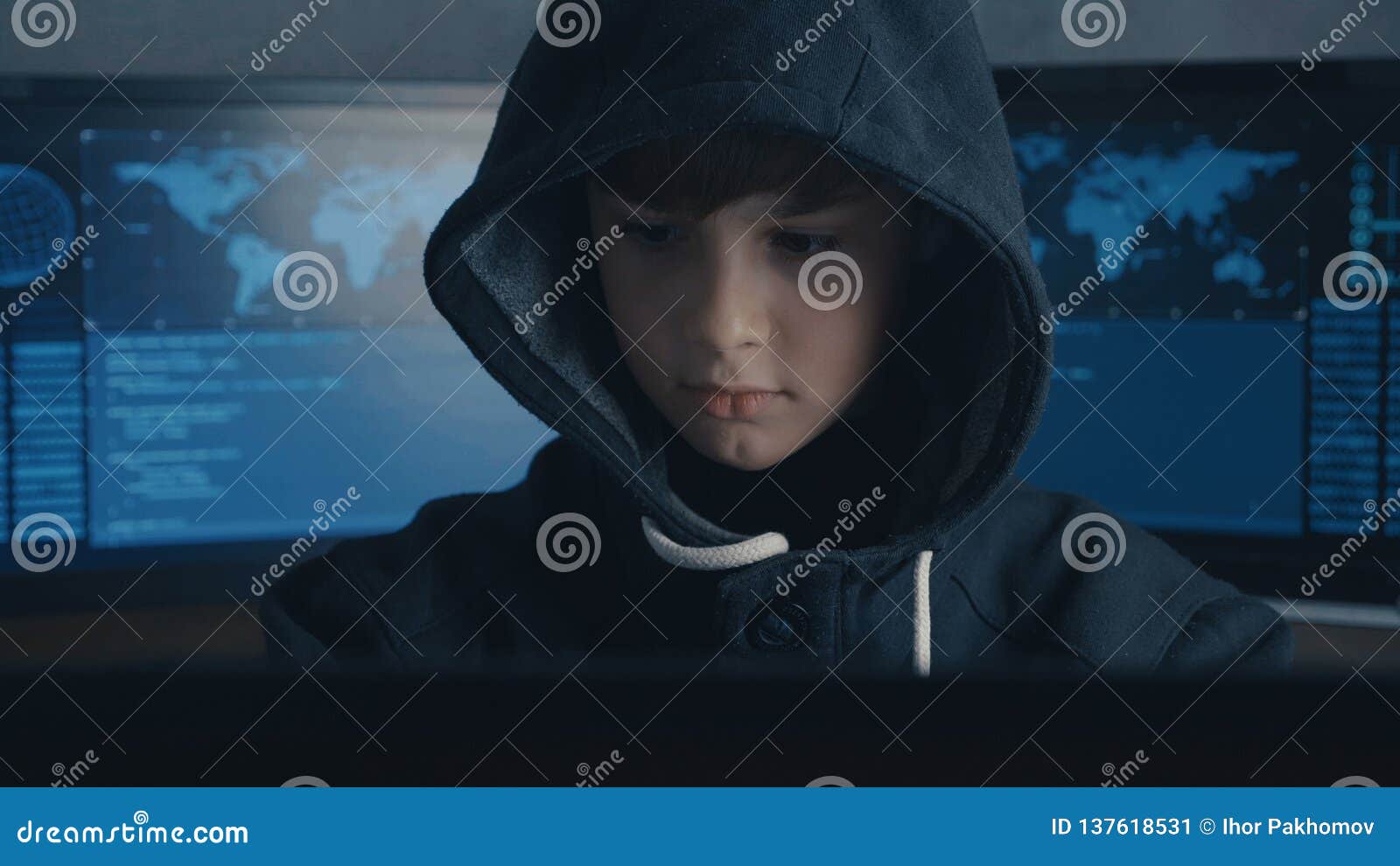 Young Prodigy Boy Hacker Programmer in Hood Working at the Computer in ...