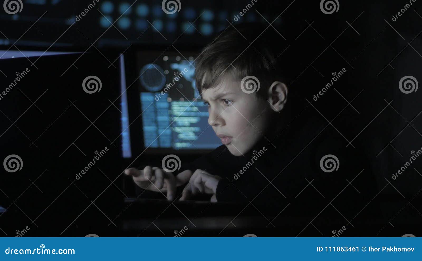 Young Prodigy Boy Hacker Programmer Working at the Computer in the Data ...