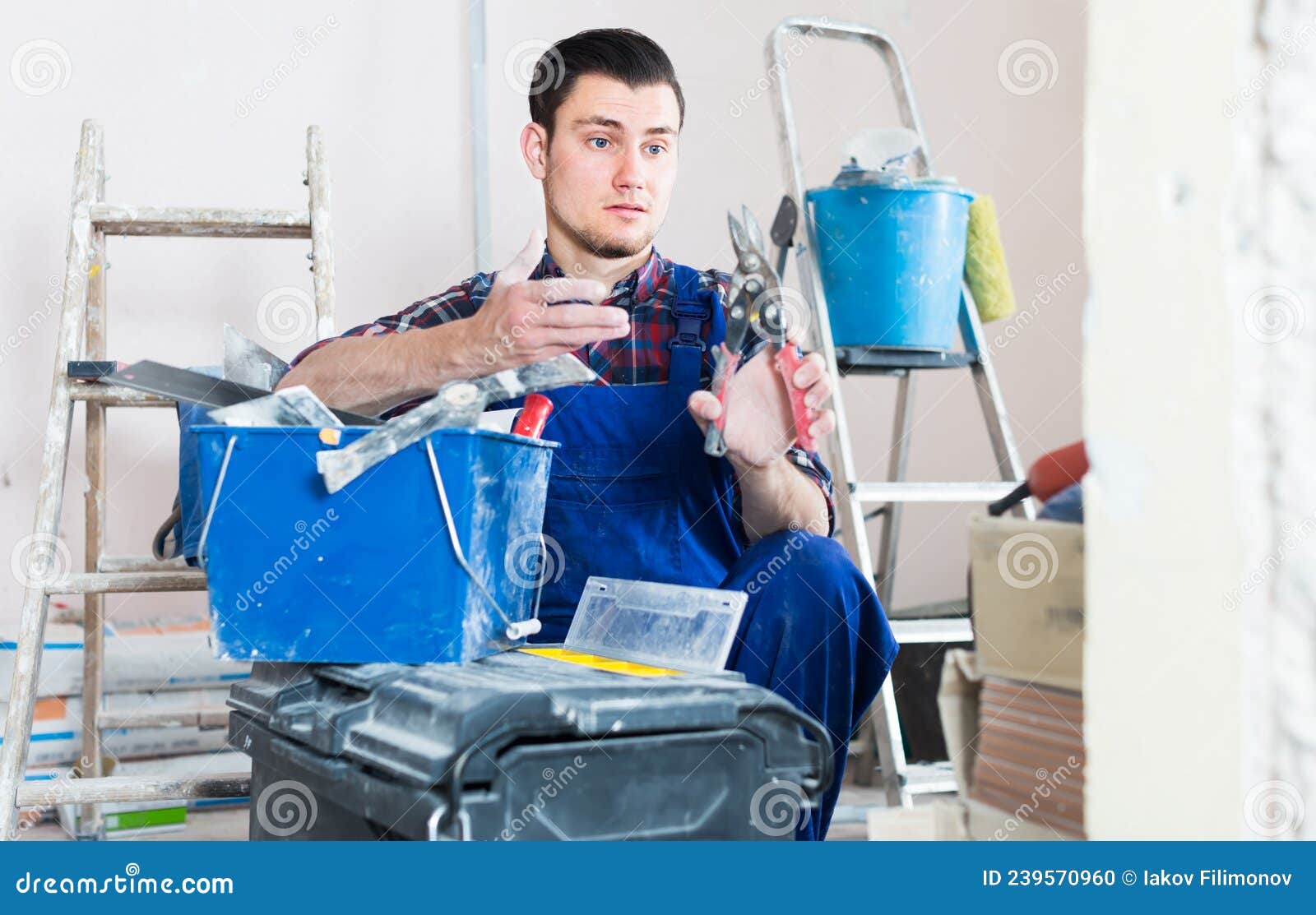 Young Professional Builder Handyman Choosing Tool in Toolbox Stock ...