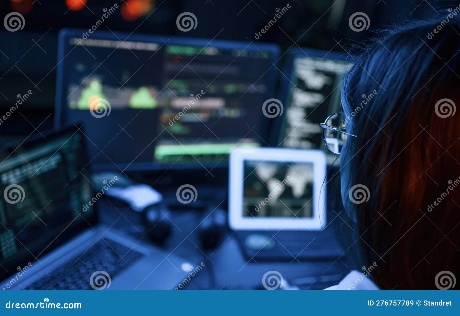 Young Professional Female Hacker is Indoors by Computer with Lot of ...