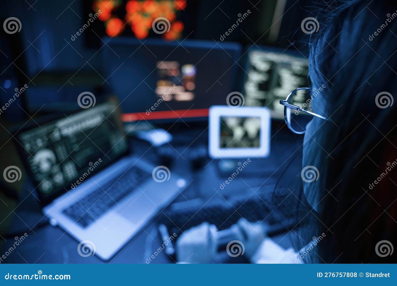 Young Professional Female Hacker is Indoors by Computer with Lot of ...