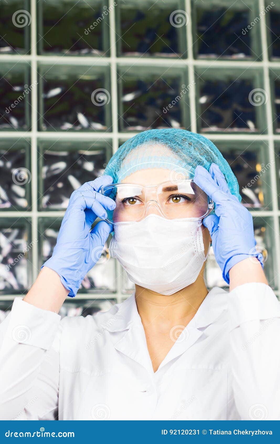 Young Professional Female Scientist Adjusting Protective Goggles. Stock ...
