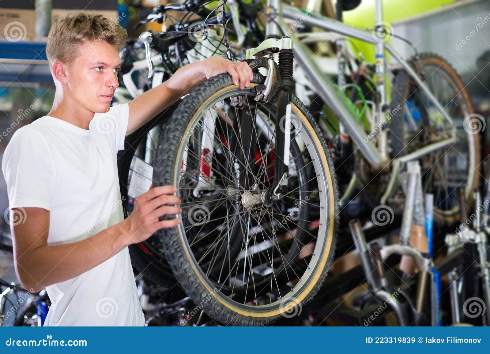 Young Professional Man Checking Tire on Wheel Stock Image - Image of ...