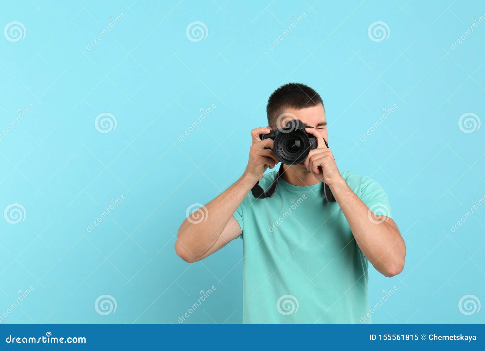 Young Professional Photographer Taking on Light Blue Background. Space ...