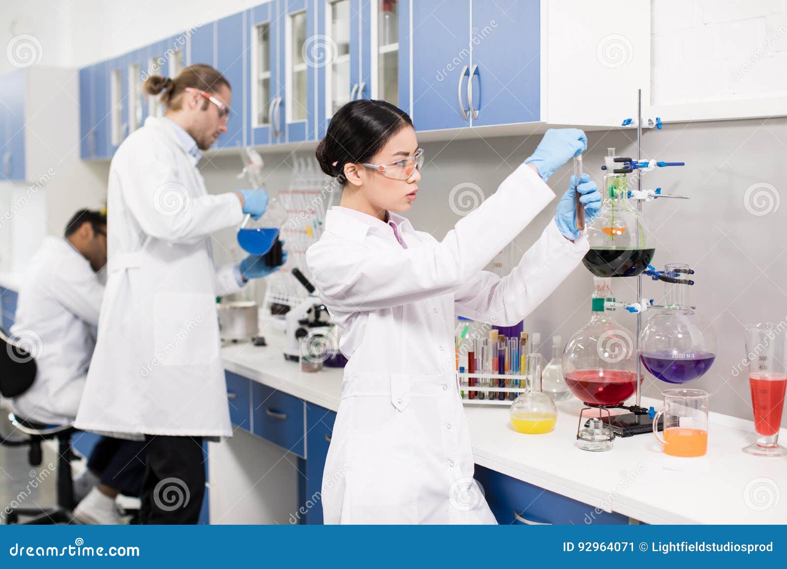 Young Professional Scientists Making Experiment in Research Laboratory ...