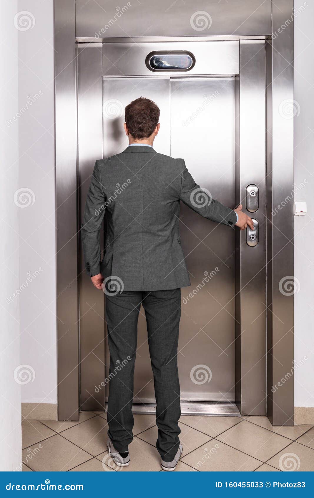 Young Professional in Suit Waiting in Front of the Elevator Stock Image ...